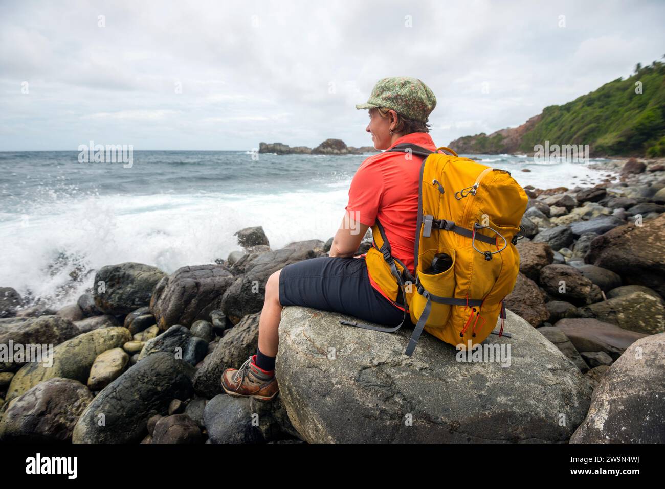 A backpacker looks out over the Atlantic Ocean while hiking Segment 6 ...