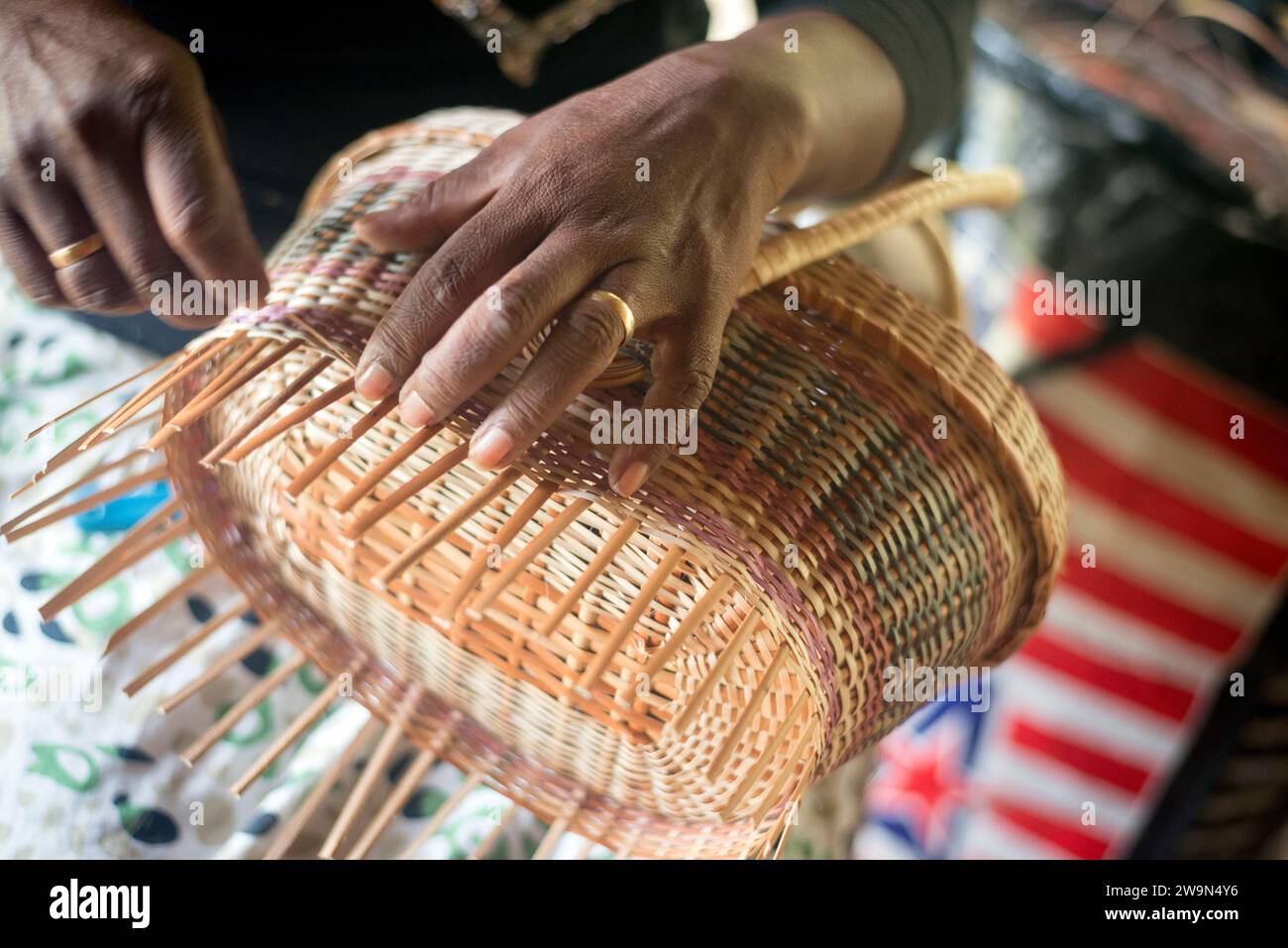 A woman weaves a traditional basket in the Touna Kalinago Heritage ...