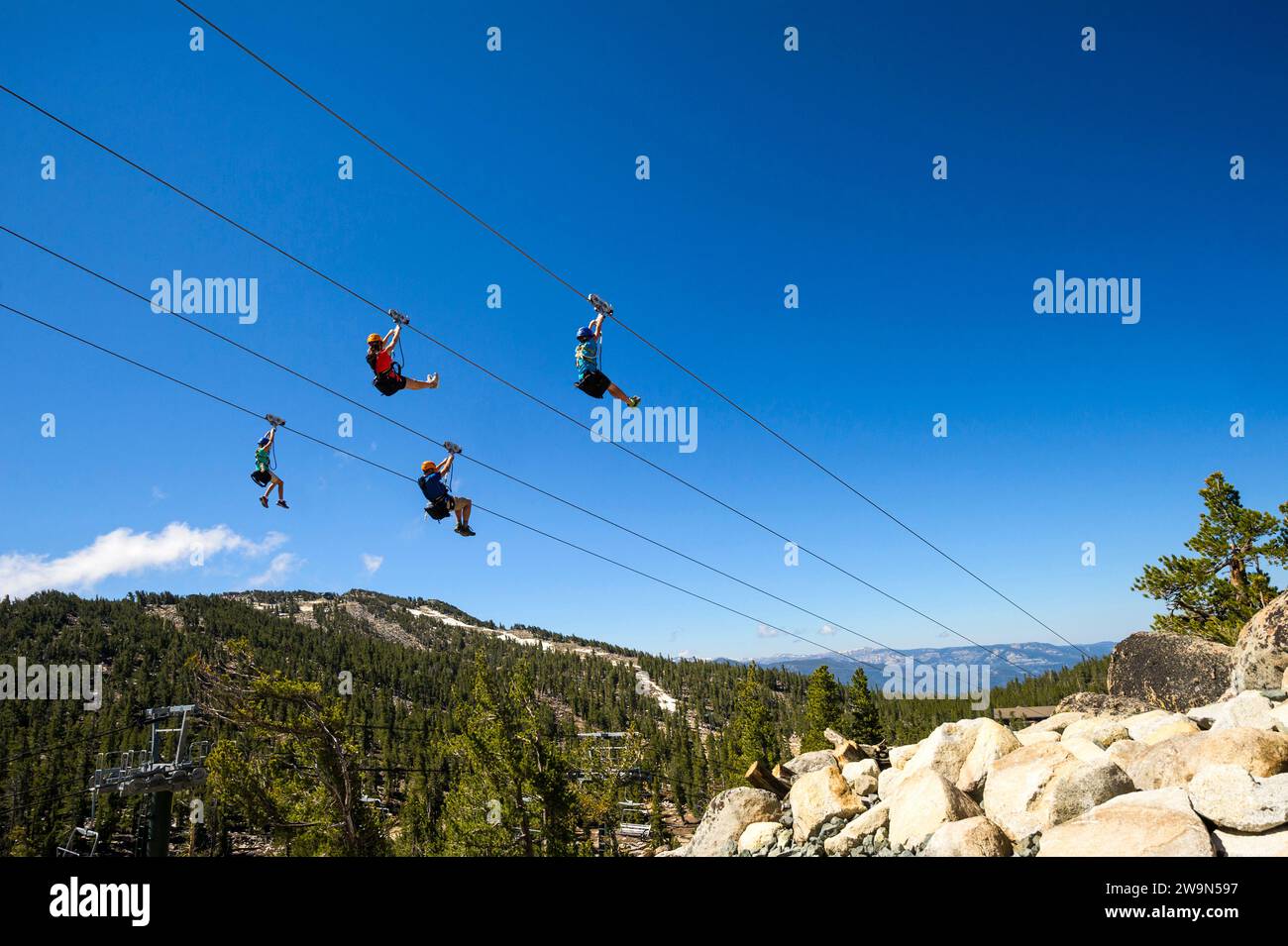 Family riding zip line, South Lake Tahoe, California, USA Stock Photo ...