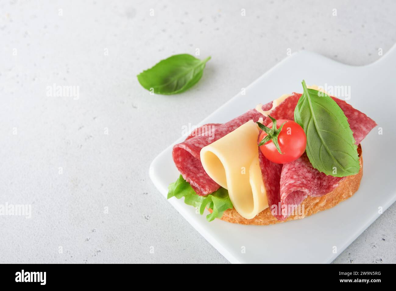 Salami sandwich. Delicious toasted sandwiches with slice salami, cheddar cheese lettuce and ...