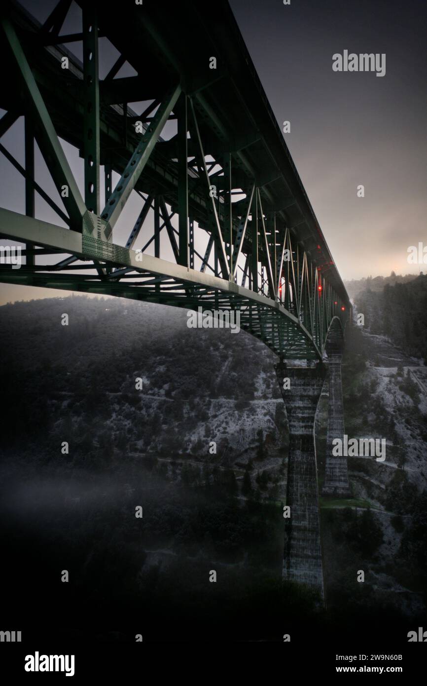 The Foresthill Bridge stretches across the snow-covered American River ...