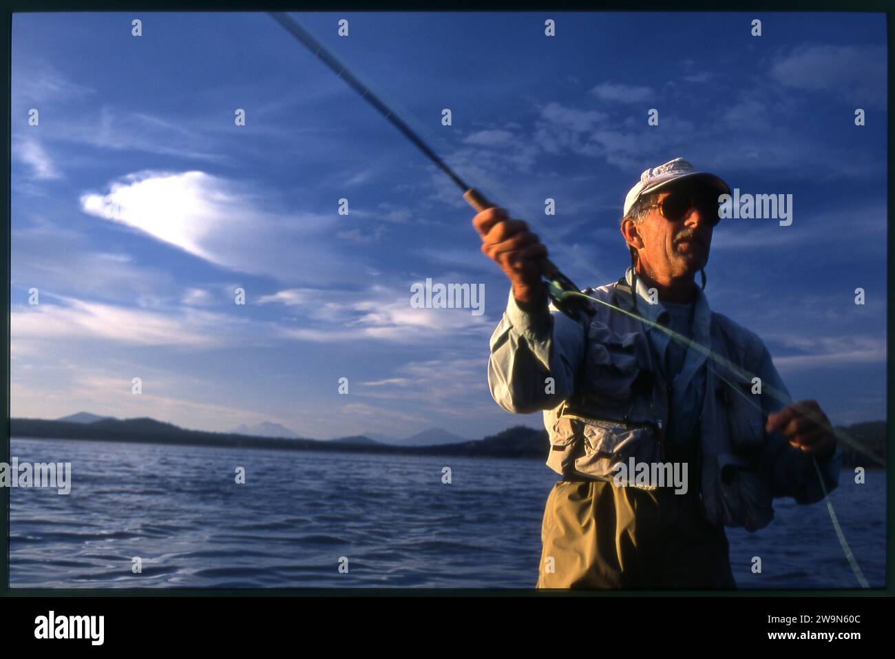 A man casting his fly rod at Oregon's Davis Lake Stock Photo - Alamy