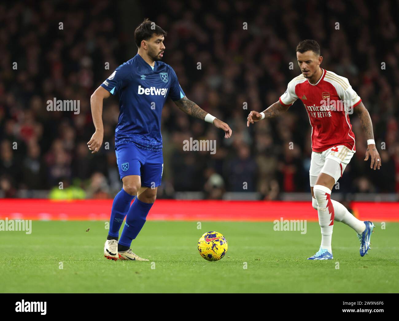 London, UK. 28th Dec, 2023. Lucas Paqueta (WHU) Ben White (A) at the ...