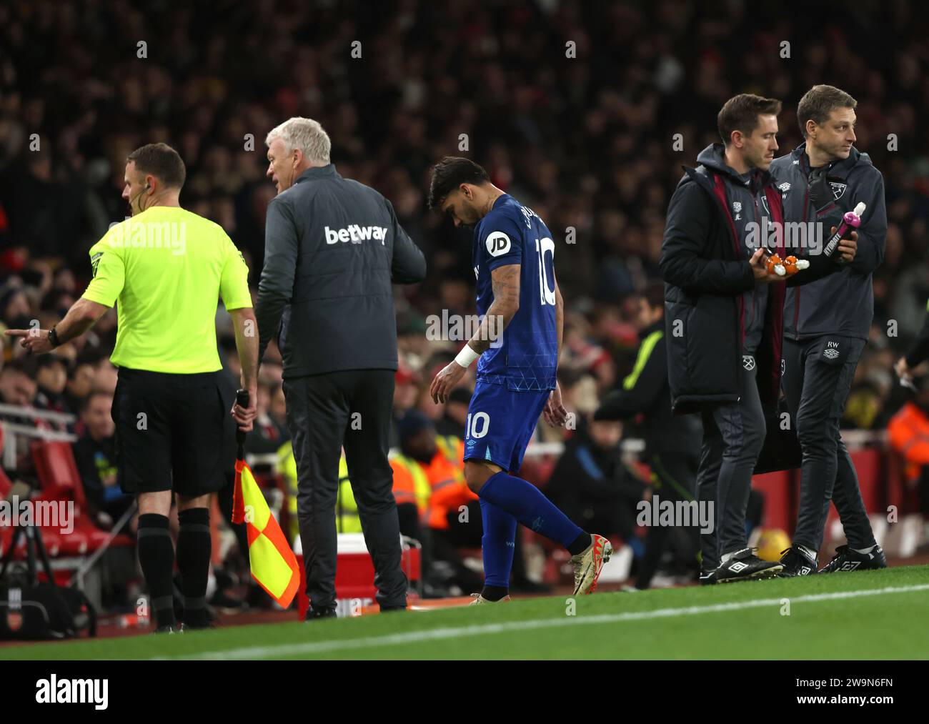 London, UK. 28th Dec, 2023. Lucas Paqueta (WHU) walks off injured at ...