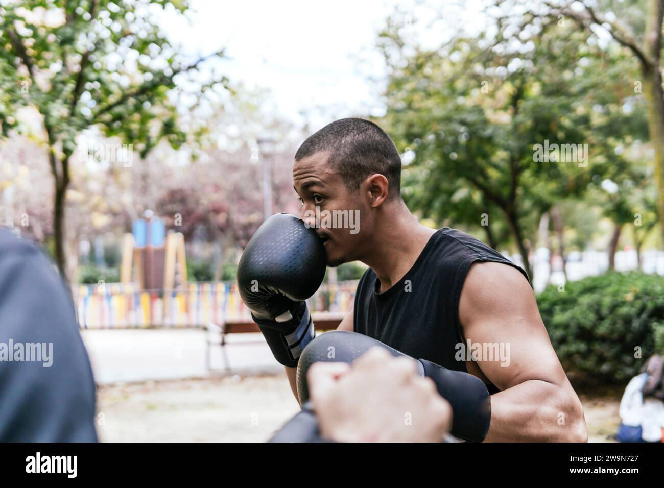 man wrestling protecting his face outdoors Stock Photo - Alamy