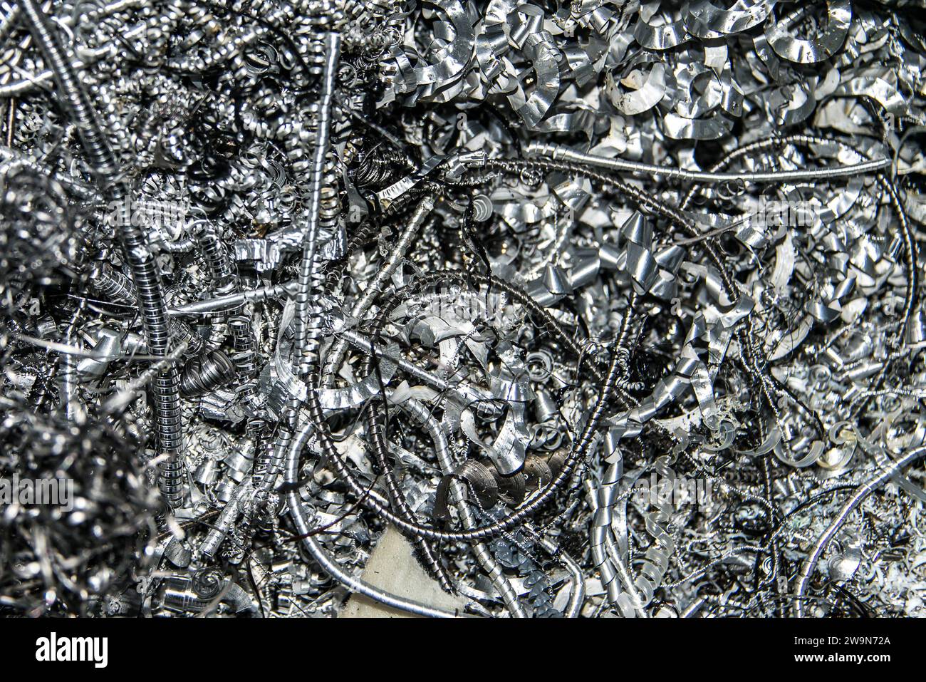 Scrap Closeup twisted spiral steel shavings twisted metal from lathe ...