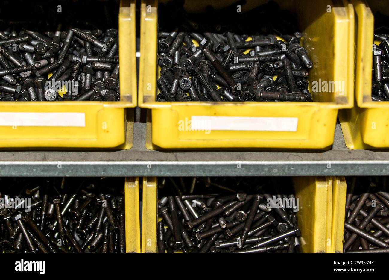 Yellow box with small construction storage compartments filled with ...