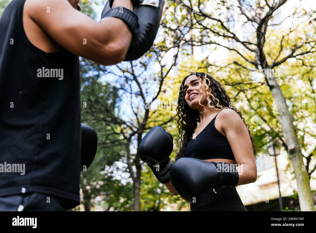 woman practicing wrestling with friend defending herself outdoors Stock ...