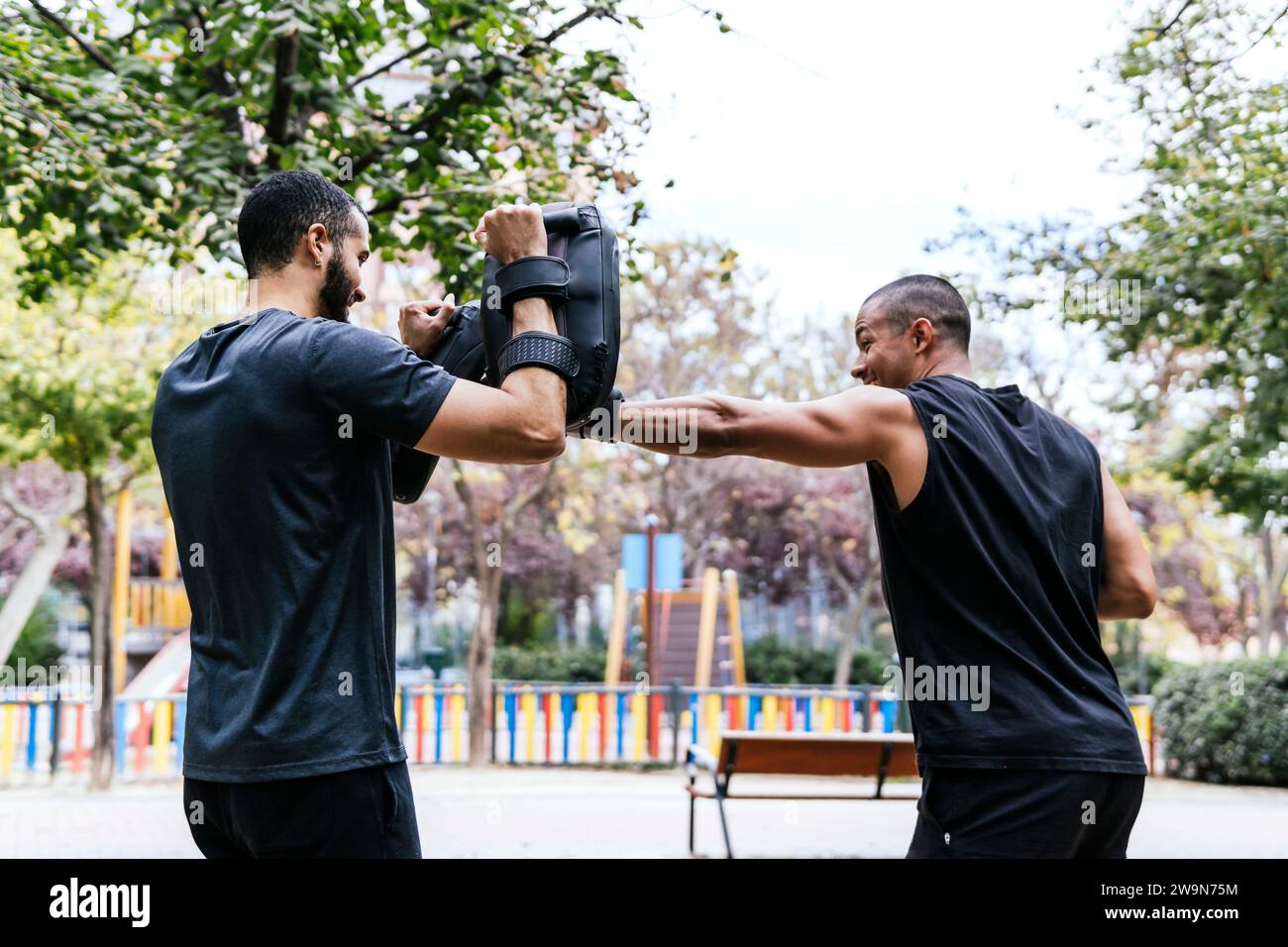 two friends practicing wrestling outdoors Stock Photo - Alamy