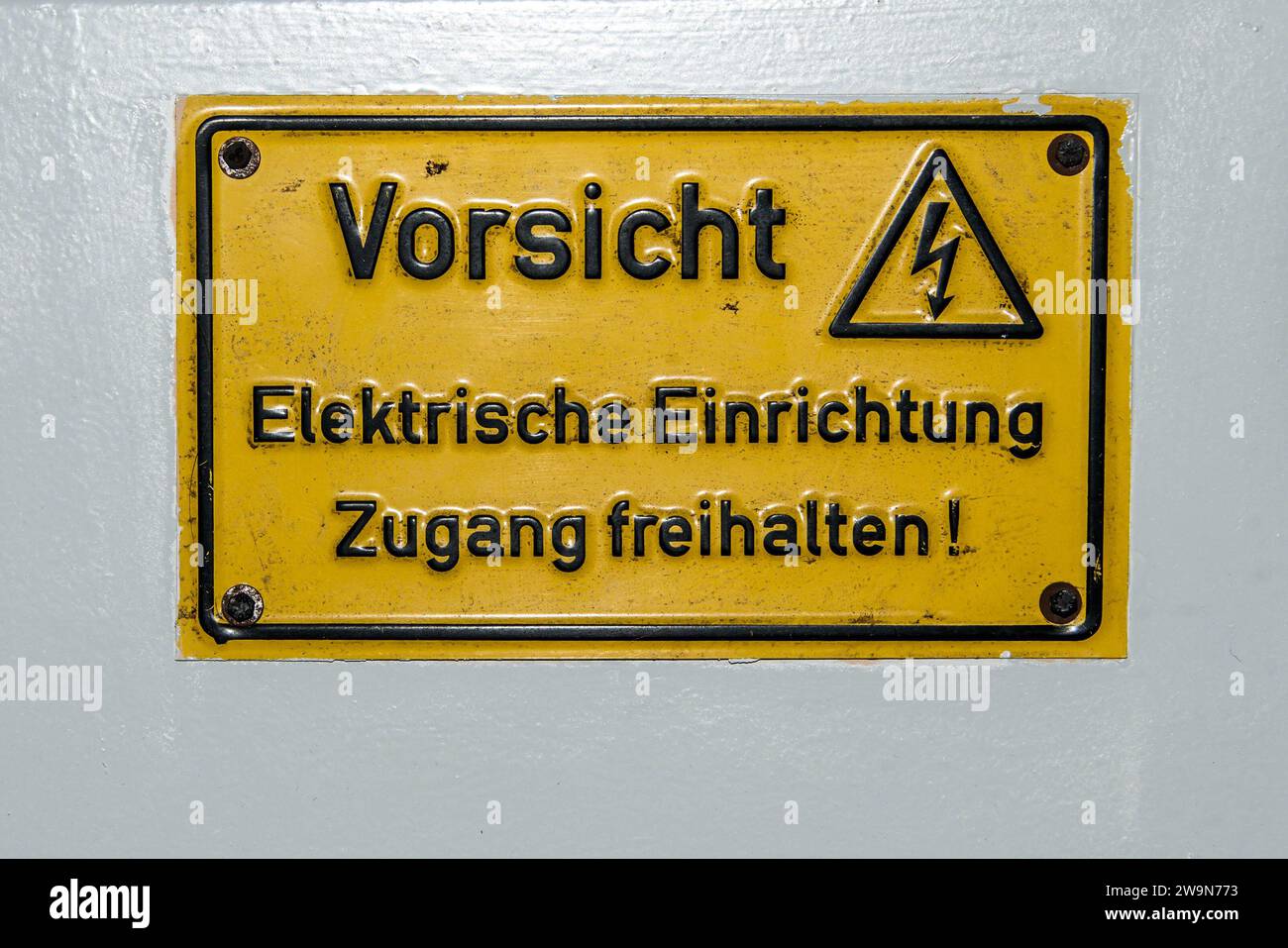 High Voltage Sign Warning in German saying Electric device do not cover ...