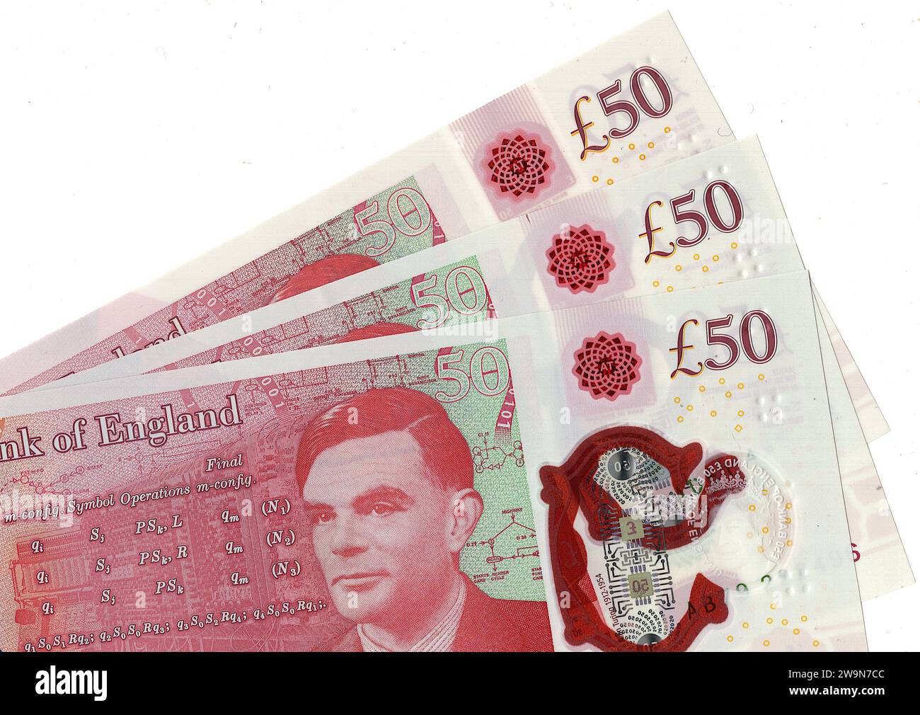 A fan of fifty pound notes featuring a portrait Alan Turing from the ...