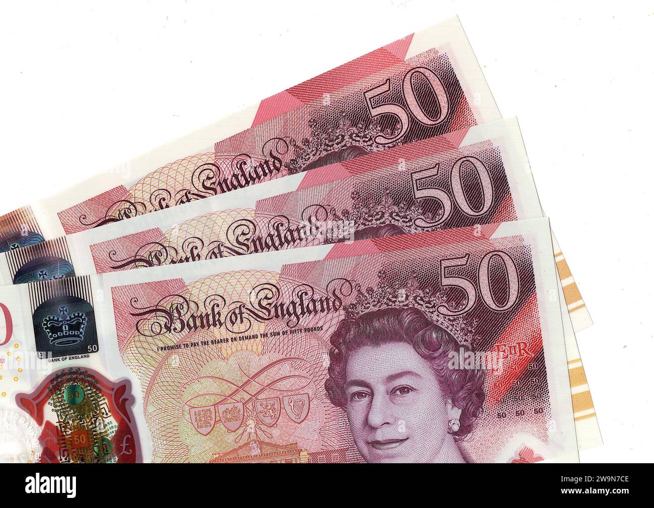 A fan of fifty pound notes featuring a portrait of Queen Elizabeth II ...