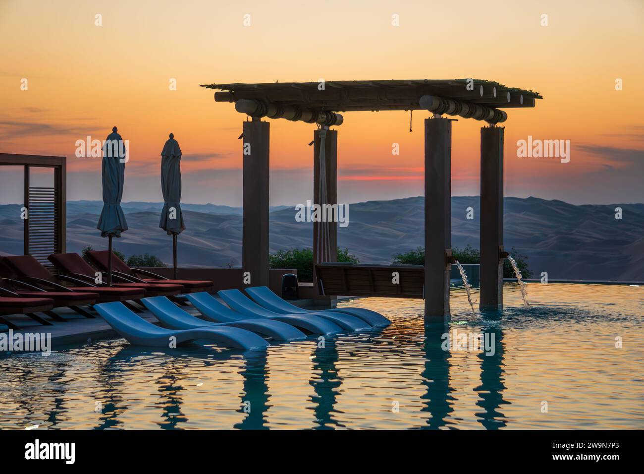 Bab al Nojoum bateen liwa resort pool and sun chairs overlooking the ...