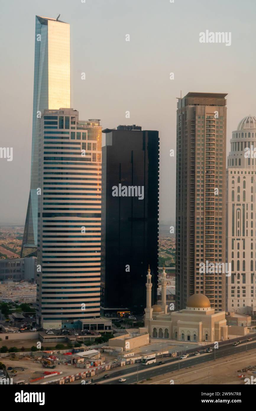 Skyscrapers in Dubai Marina surrounding a mosque, at sunset. United ...