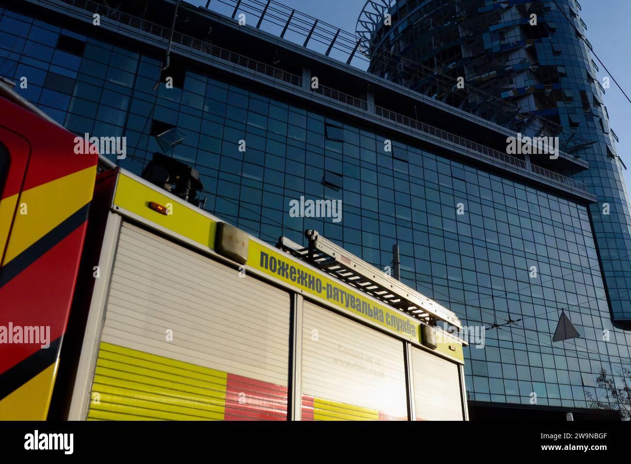 Kyiv, Ukraine. 29th Dec, 2023. The damaged facade of an office building ...