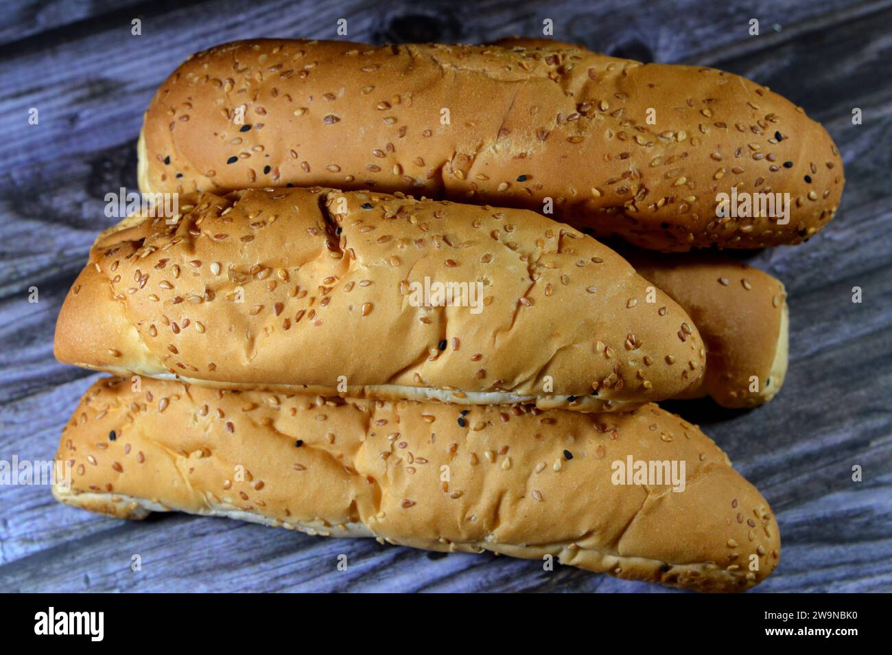 Long sesame and black Baraka seed bun bread, fresh baked loaf of bread ...