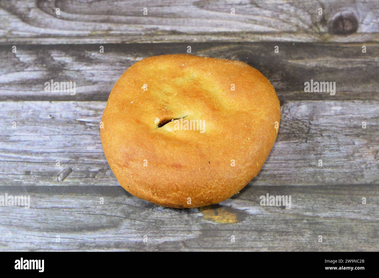 soft and chewy Date Filled Ajwa Agwa bun, golden-brown glaze dessert ...