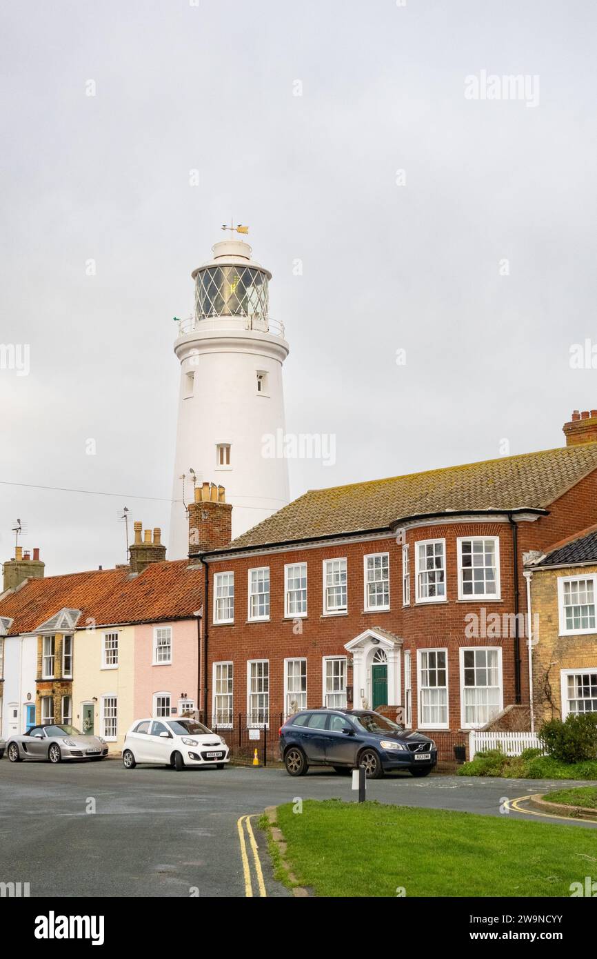 Southwold lighthouse rising above the historic buildings of the town ...