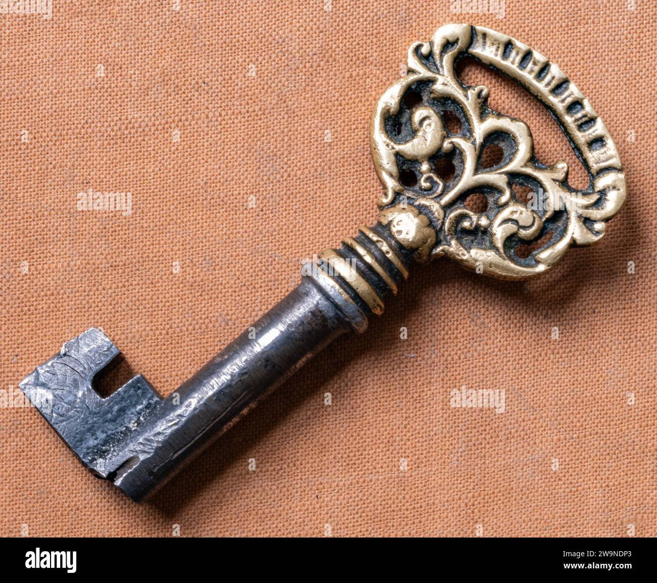 Decorative key for lock on antique French wardrobe Stock Photo - Alamy