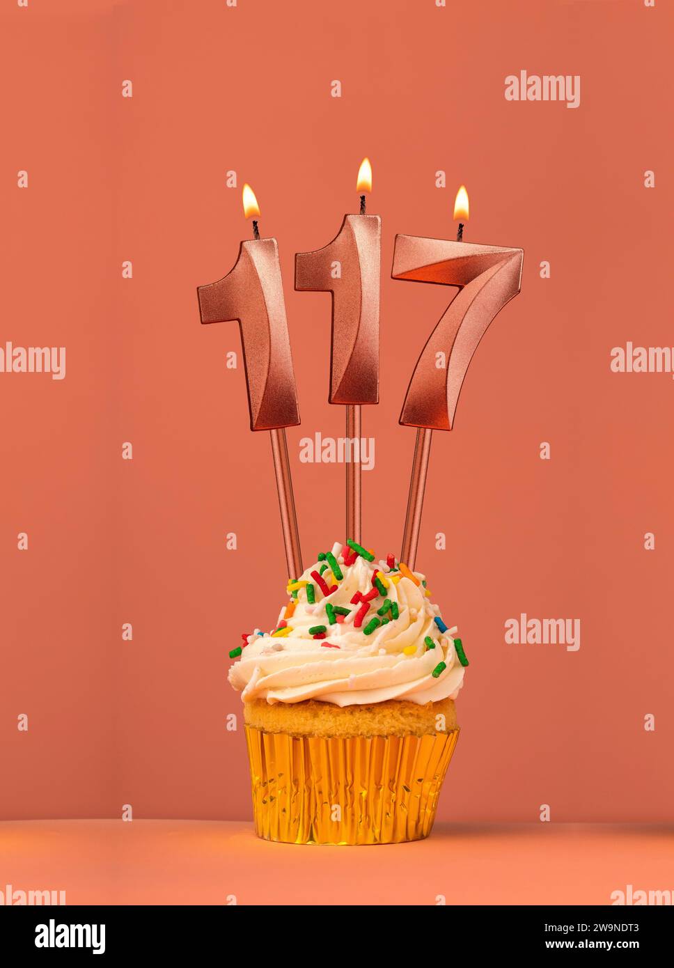 Birthday cake with candle number 117 - Coral fusion background Stock ...