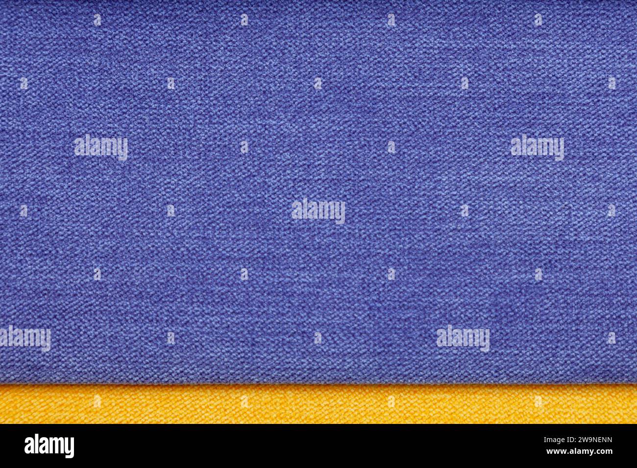 Background image of two pieces of multi-colored fabric Stock Photo - Alamy