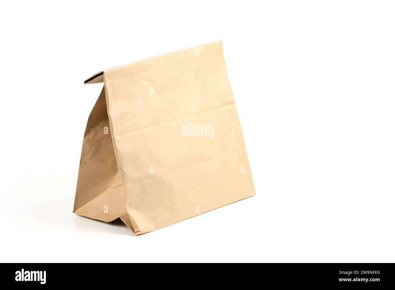 Close and full paper disposable bag of brown kraft paper isolated on ...