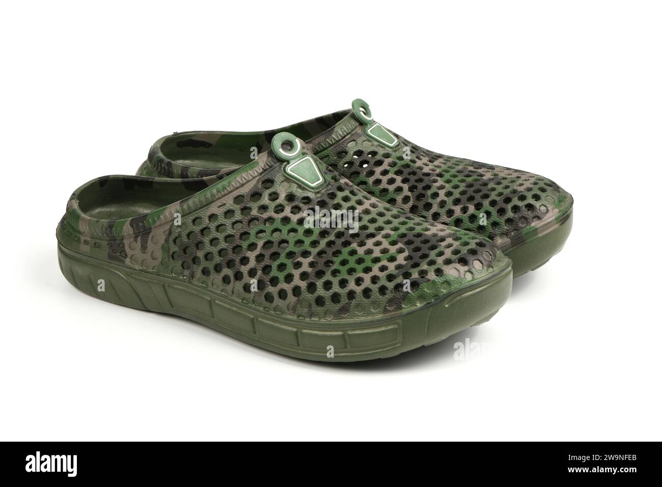 Pair dark green galoshes isolated on a white background. Shoes for ...