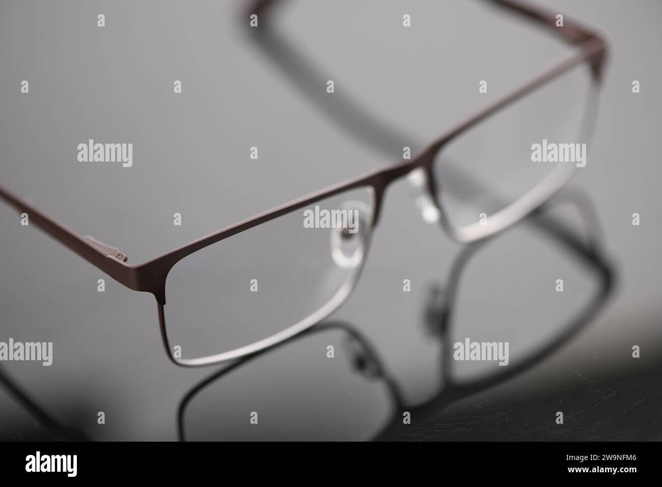Reading glasses isolated on mirror background. High resolution photo ...