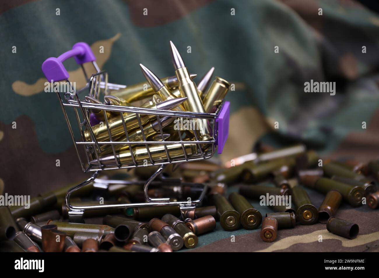 Rifle cartridges in small shopping cart. Big caliber ammo cartridges ...