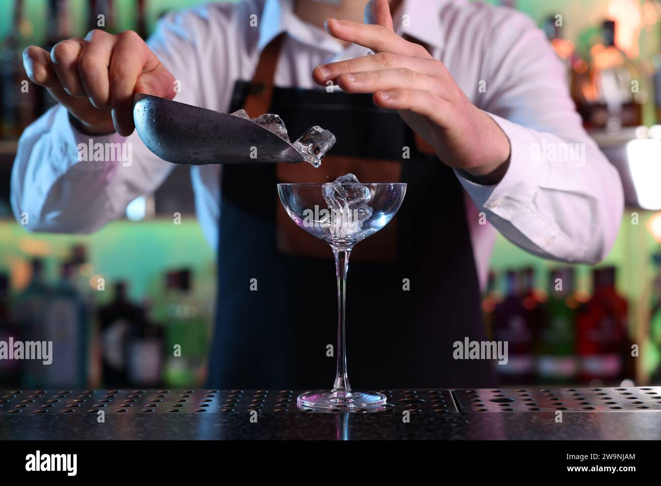 Adding liquid martini glass ice hi-res stock photography and images - Alamy