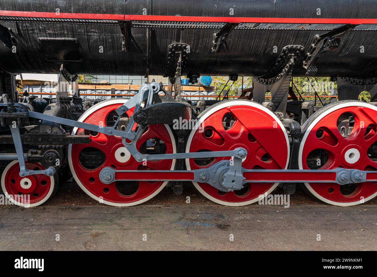 Red wheels of an old black locomotive on the railroad Stock Photo - Alamy
