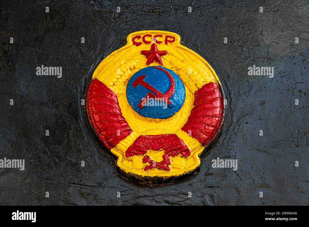The coat of arms of the Soviet Union with a hammer, star and sickle ...