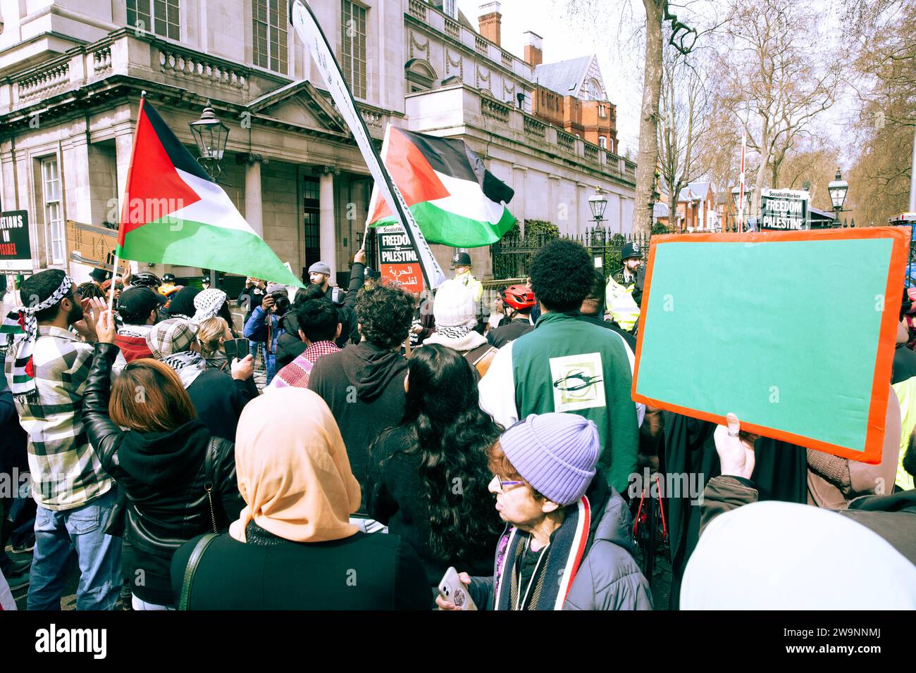 Pro-Palestinian protesters gather with flags and placards during a ...