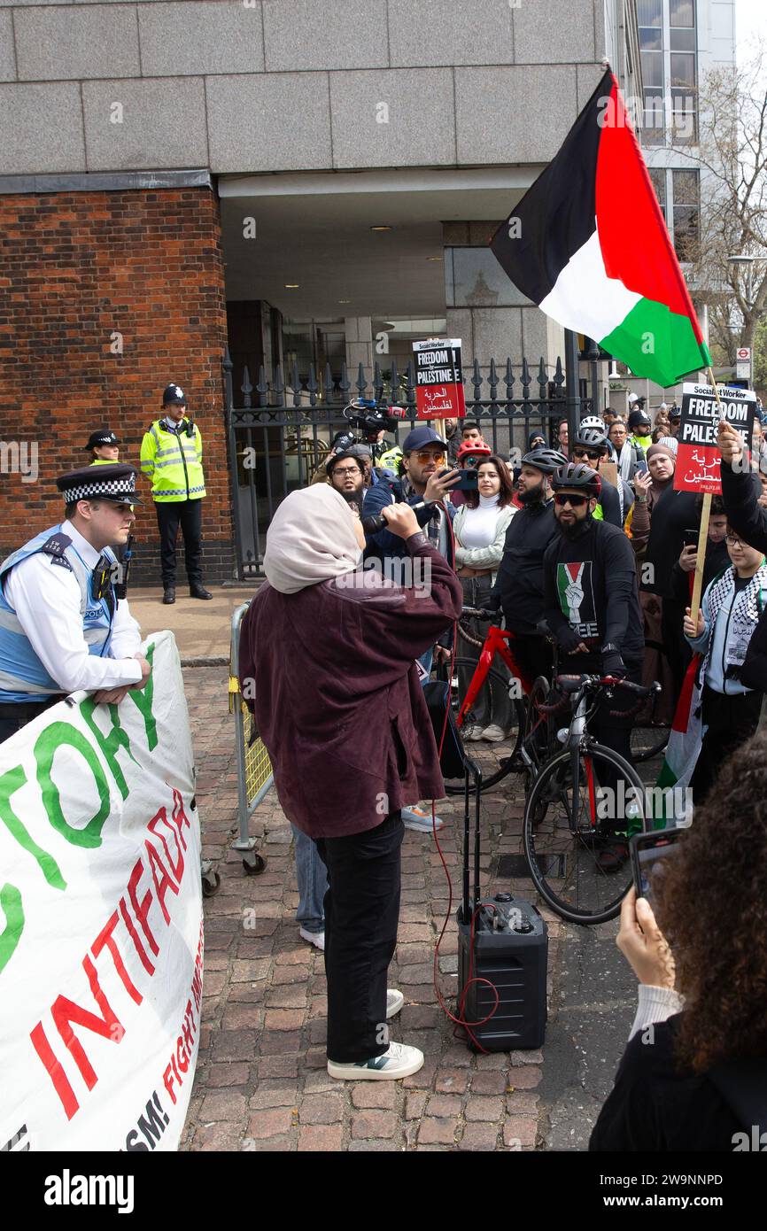 Pro-Palestinian protesters gather with flags and placards during a ...