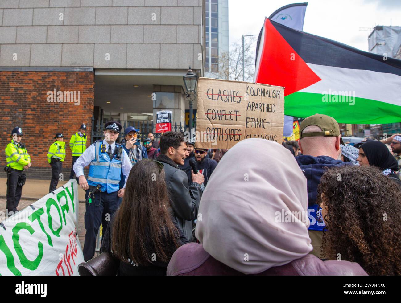 Pro-Palestinian protesters gather with flags and placards during a ...