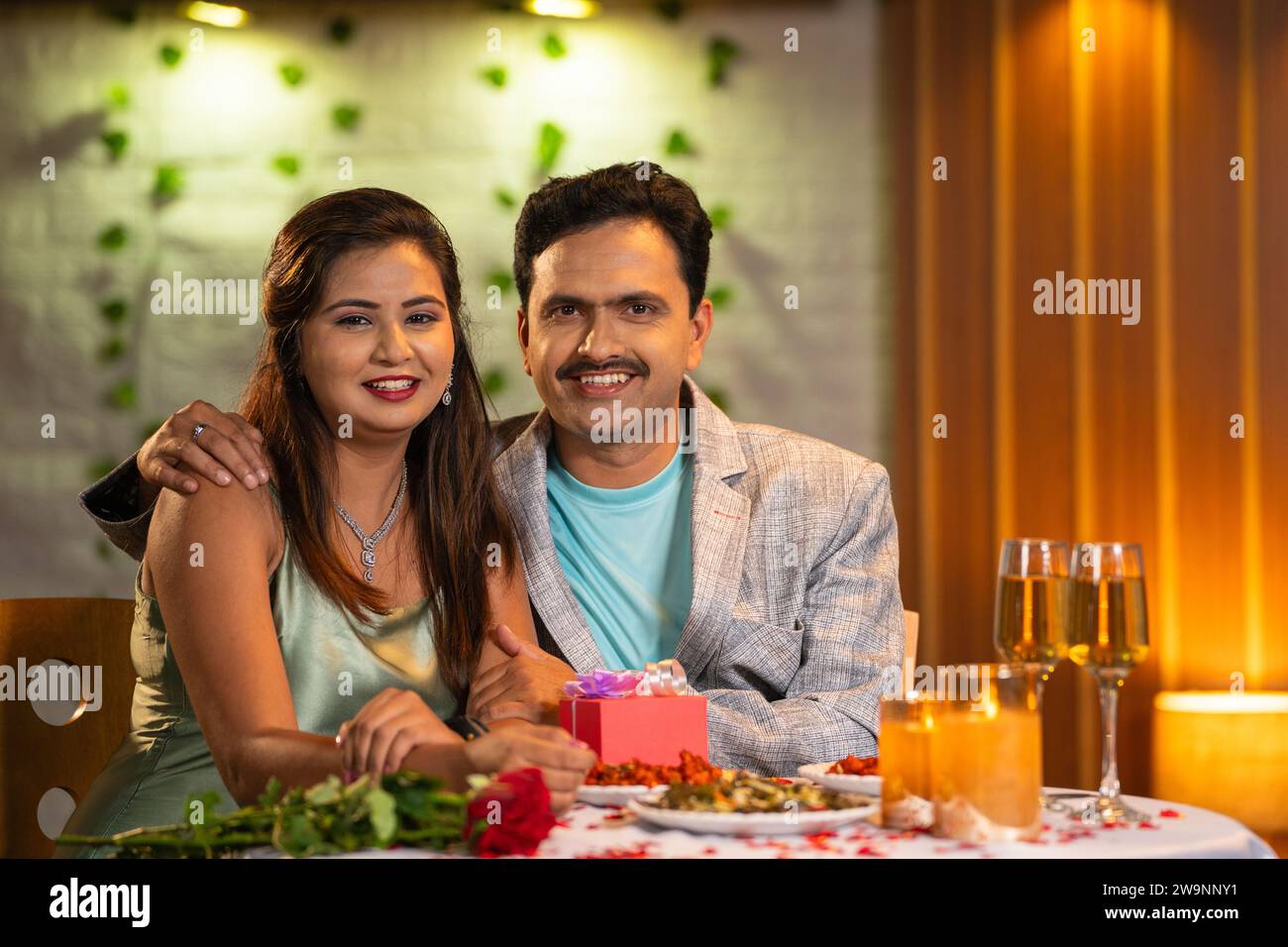 portrait shot of Joyful romantic couples at candlelight dinner looking ...