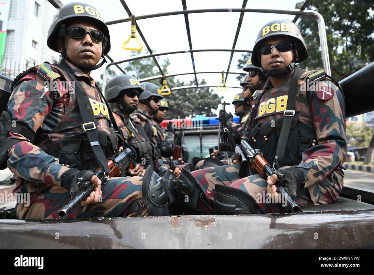 Members of Border Guard Bangladesh (BGB) stand guard in a street for ...