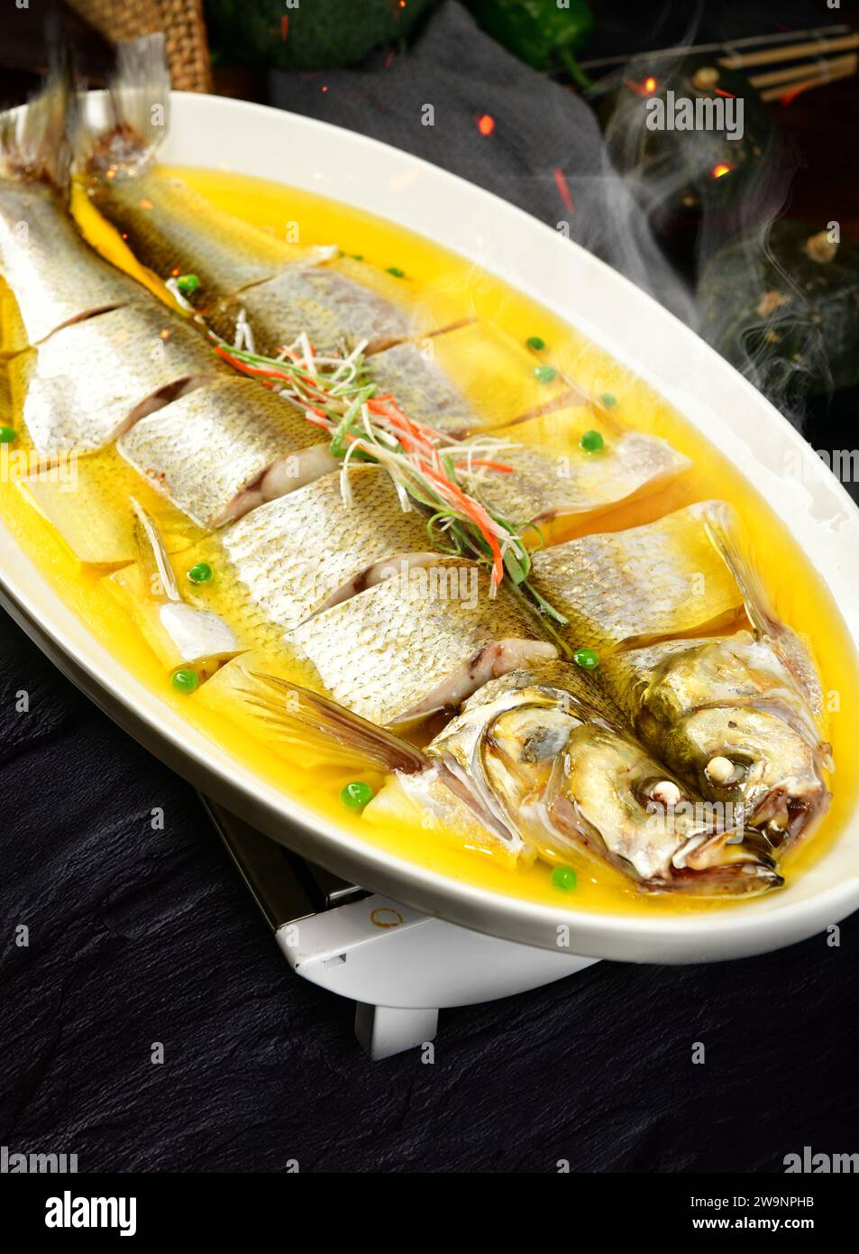 Steamed Topmouth culter fish with ham，Steamed white fish Stock Photo ...