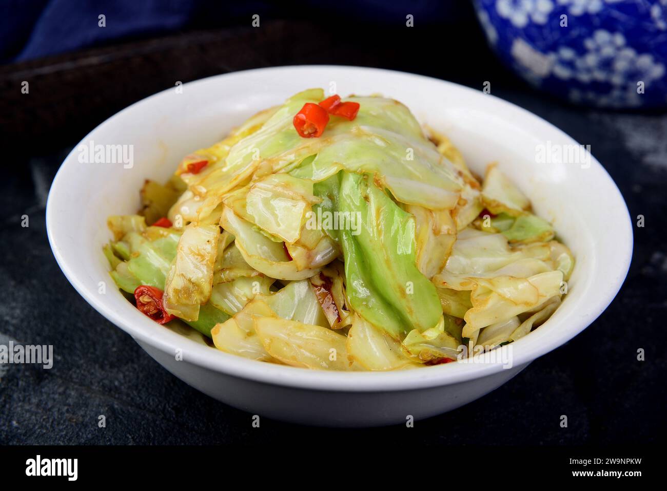 Stir fried streaky pork with purple cabbage in claypot Stock Photo - Alamy