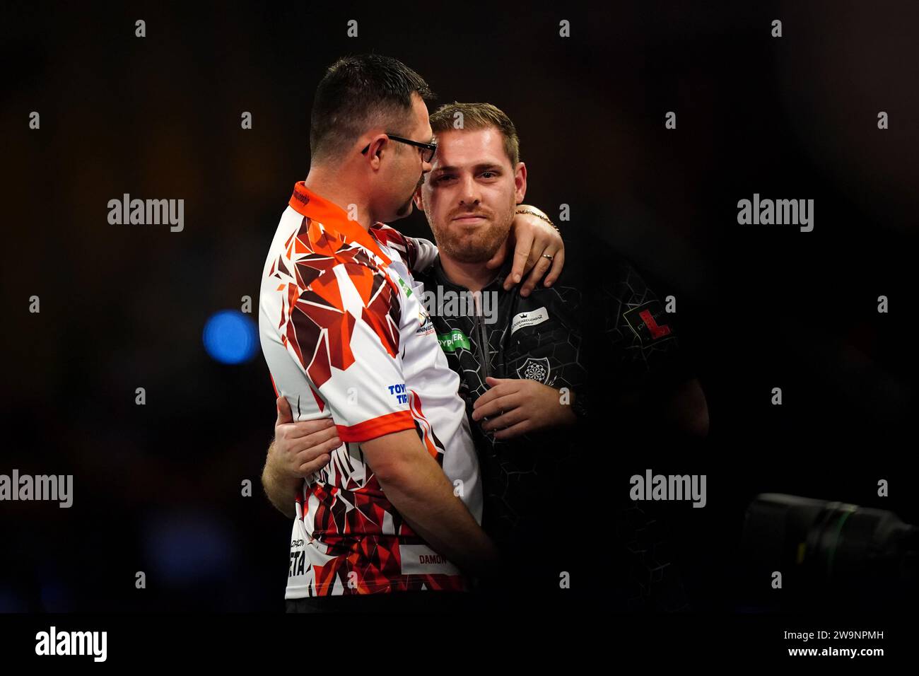 Damon Heta celebrates after beating Berry van Peer (right) on day ...