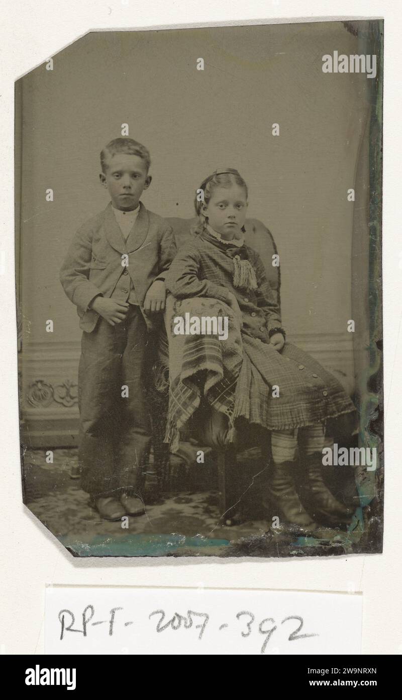 Portrait of a girl and boy (brother and sister?), Sitting and standing ...