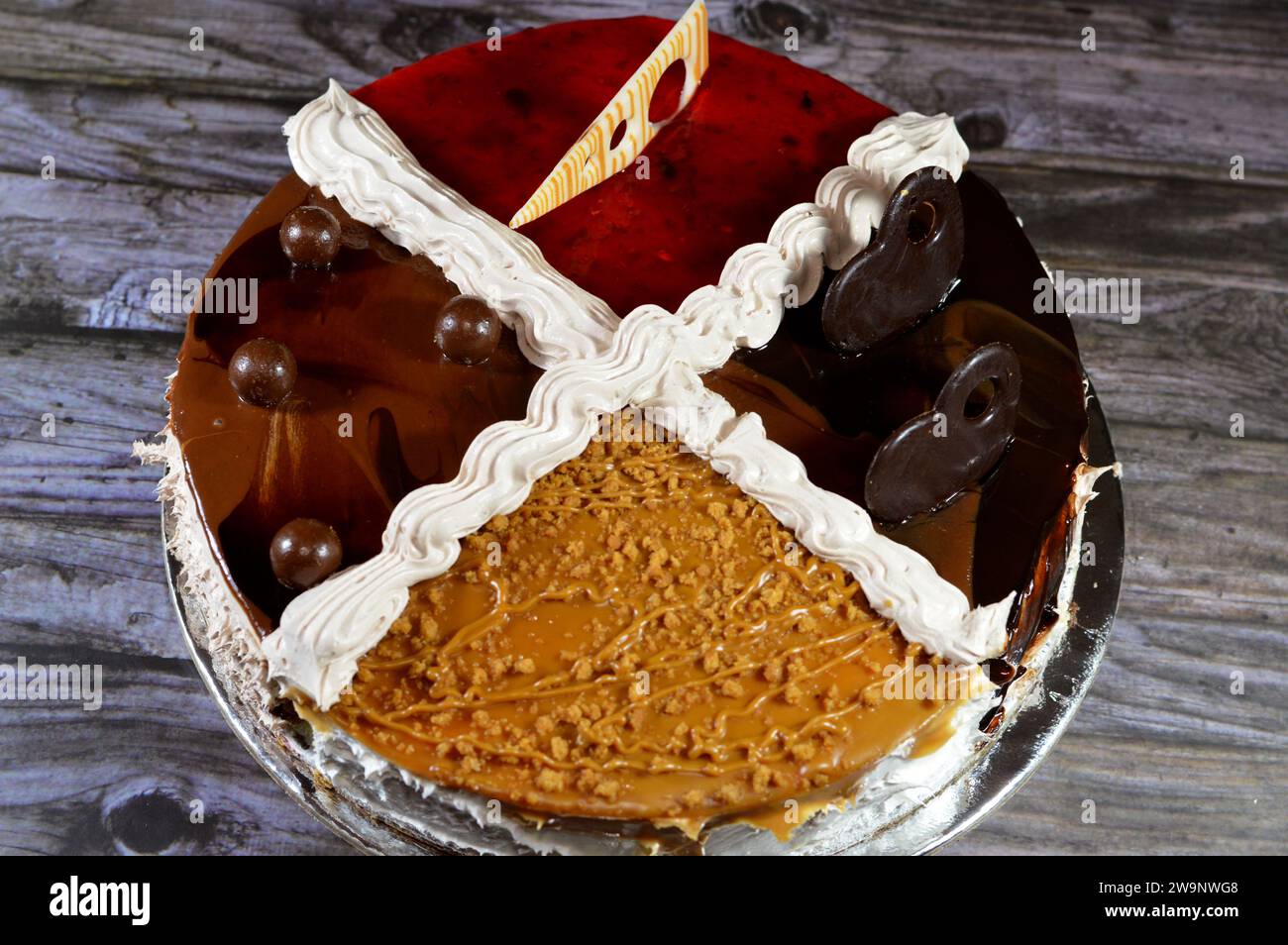 A birthday cake, four different quarters spongy creamy cake for ...