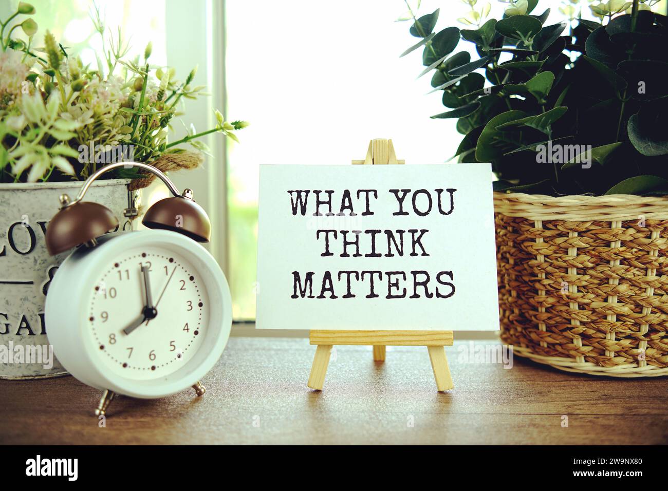 What you think matters text message on paper card with wooden easel ...