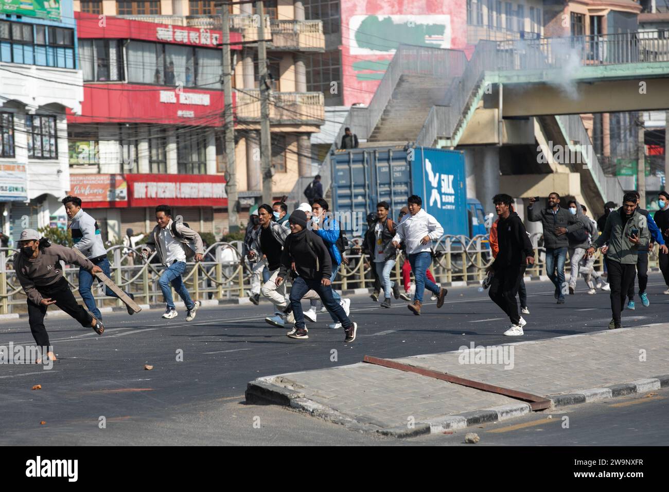 Students seen running in the streets during the demonstration. Two ...