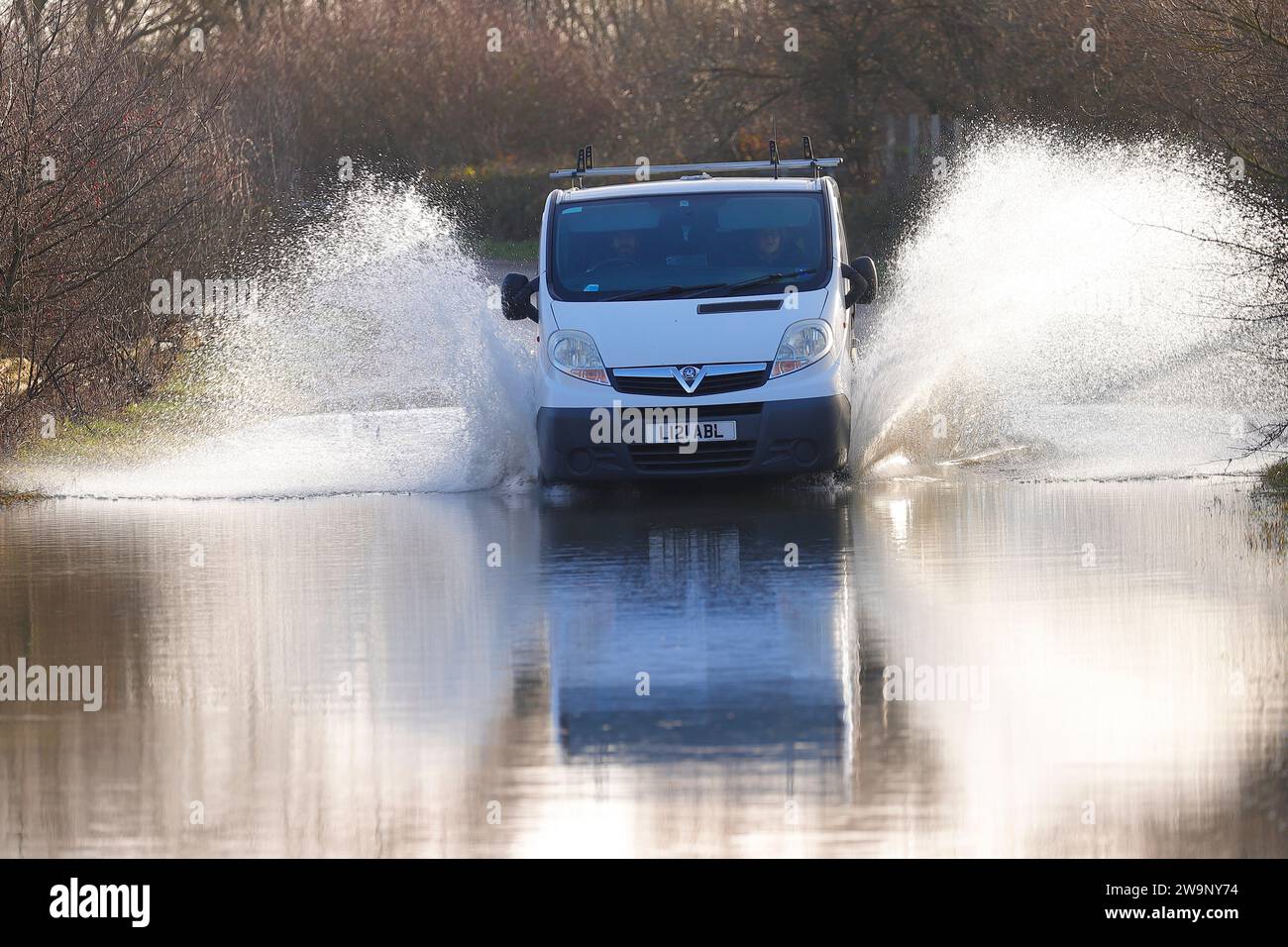 A car seen drinving through floodwater at Fairburn Ings in North ...