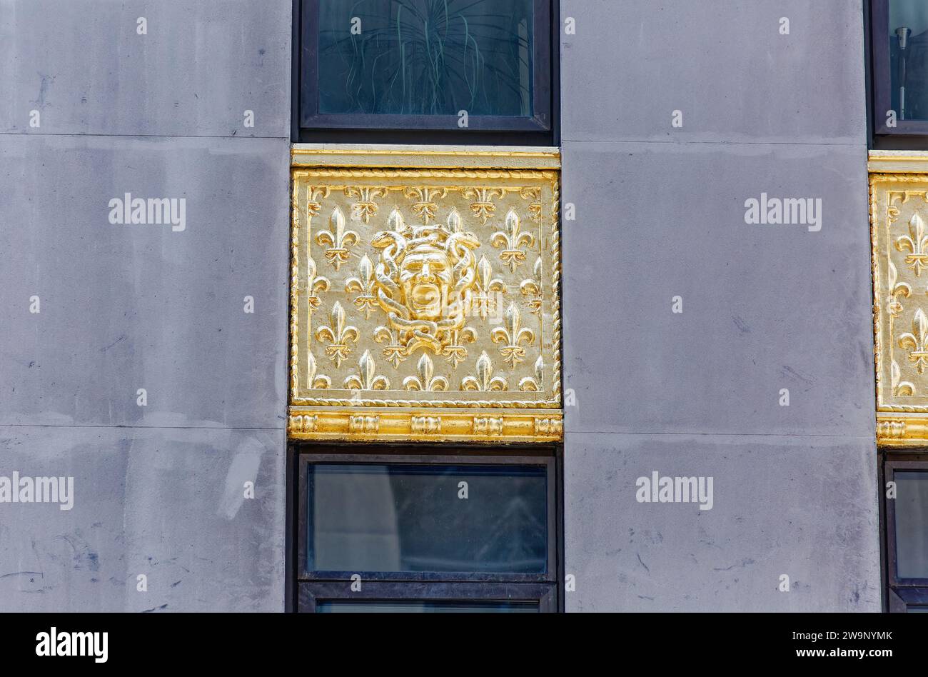 Fanciful gilt and terra cotta embellish the brick and stone façade of ...