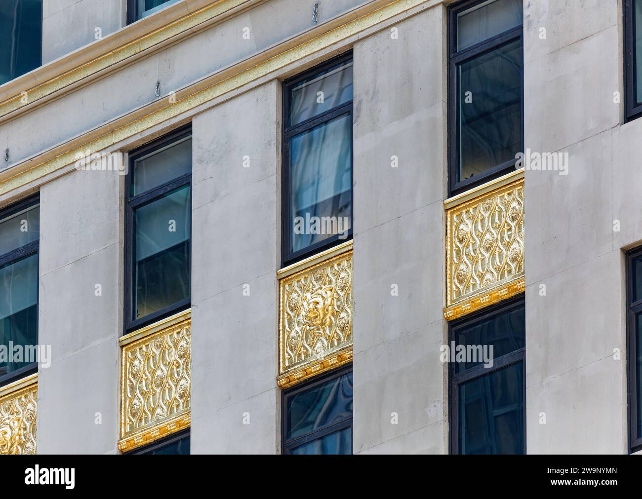 Fanciful gilt and terra cotta embellish the brick and stone façade of ...
