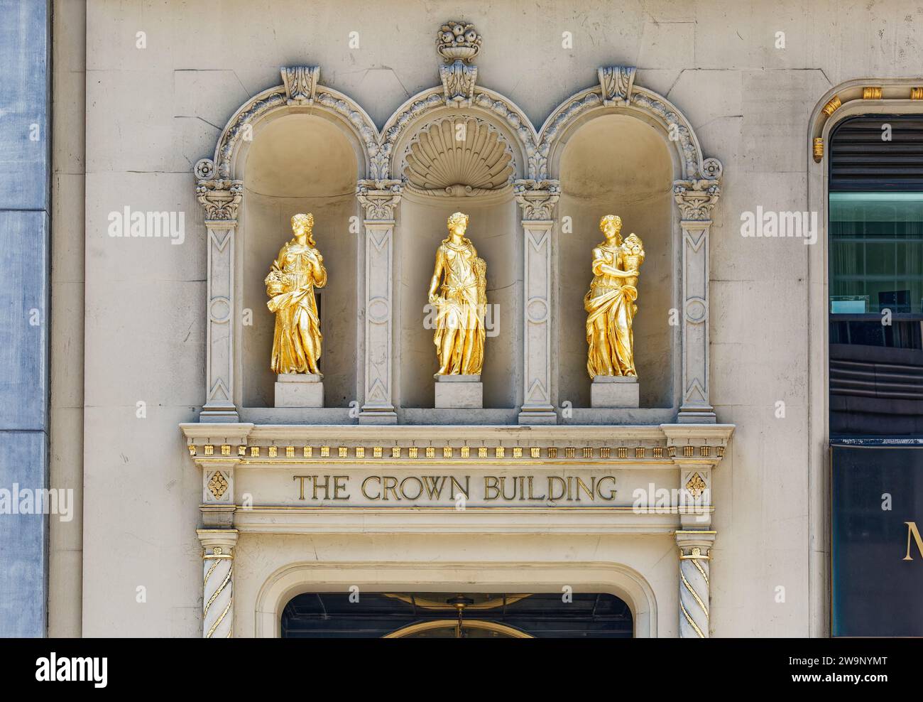 Fanciful gilt and terra cotta embellish the brick and stone façade of ...
