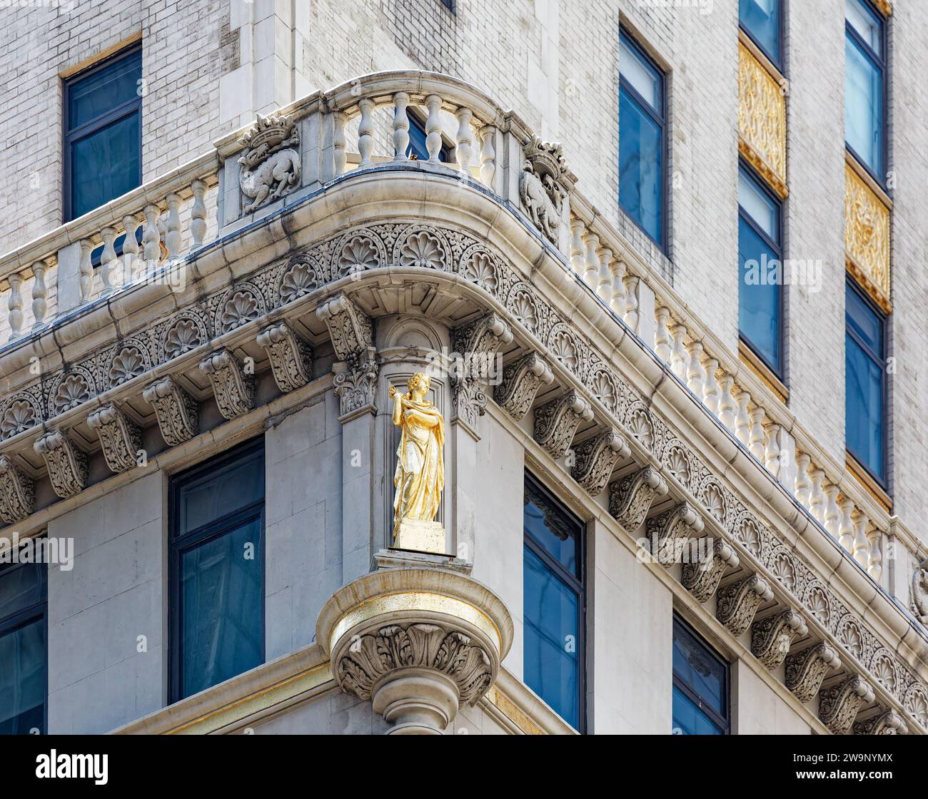 Fanciful gilt and terra cotta embellish the brick and stone façade of ...