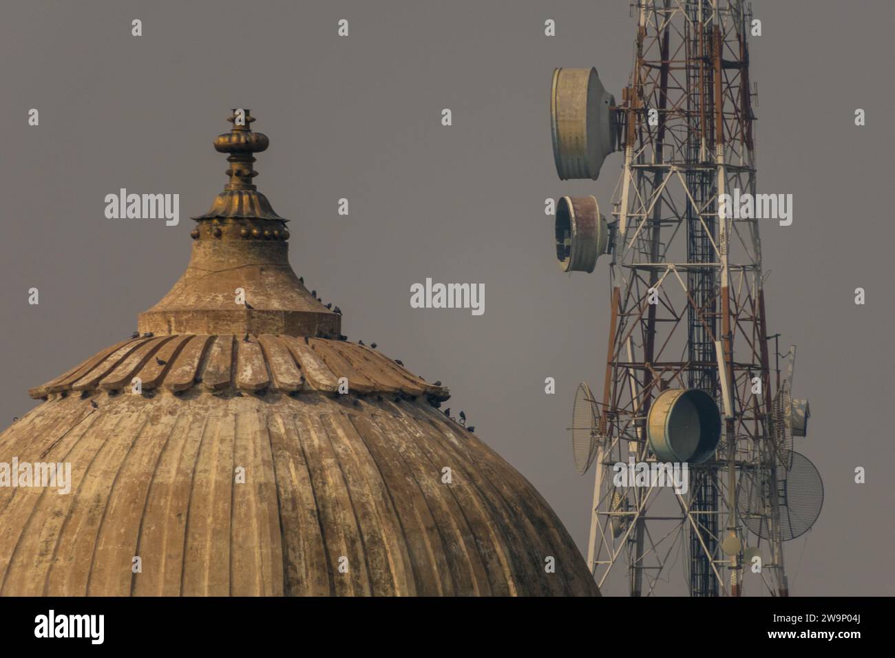 Contrast between the ancient dome of Sadat Ali Khan Tomb and modern ...